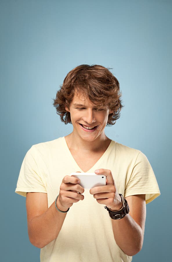 Young Man Texting stock photo. Image of mobile, front - 30979118