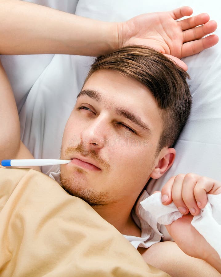 Young Man with a Thermometer Stock Photo - Image of attractive, illness ...