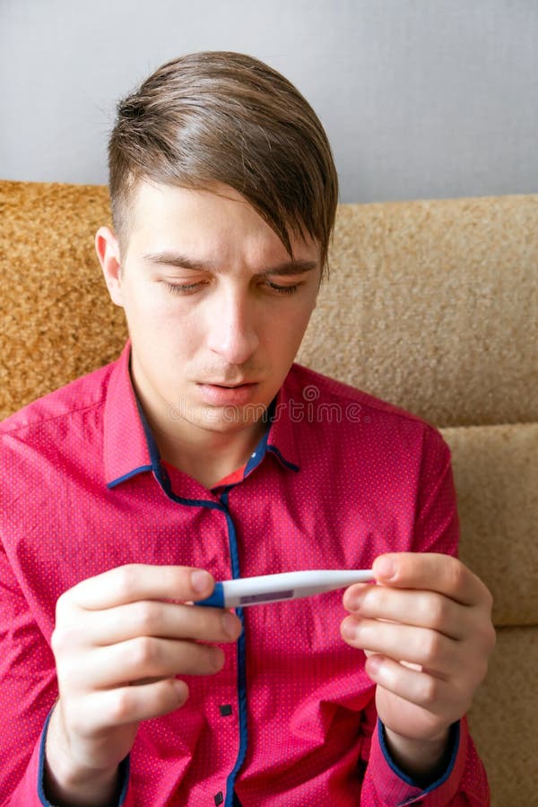 Young Man with a Thermometer Stock Photo - Image of adult, measure: 264986144