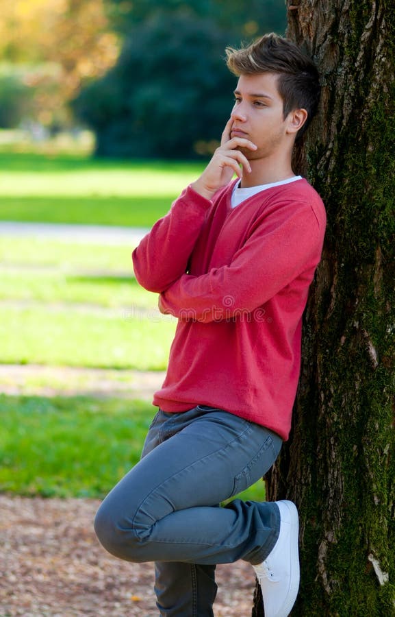 Young Man Thinking stock image. Image of teenager, sadness - 27341091