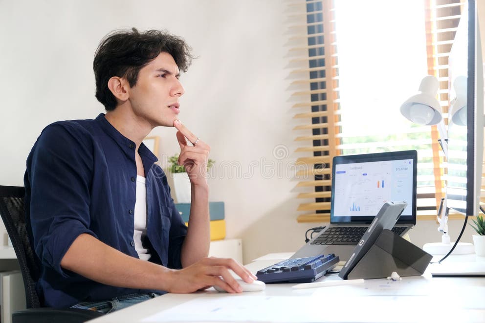 Young Man Thinking while Working with Computer at Home Office, Wrok ...