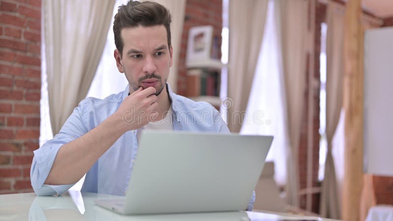 Young Man Thinking and Working on Laptop Stock Photo - Image of laptop ...
