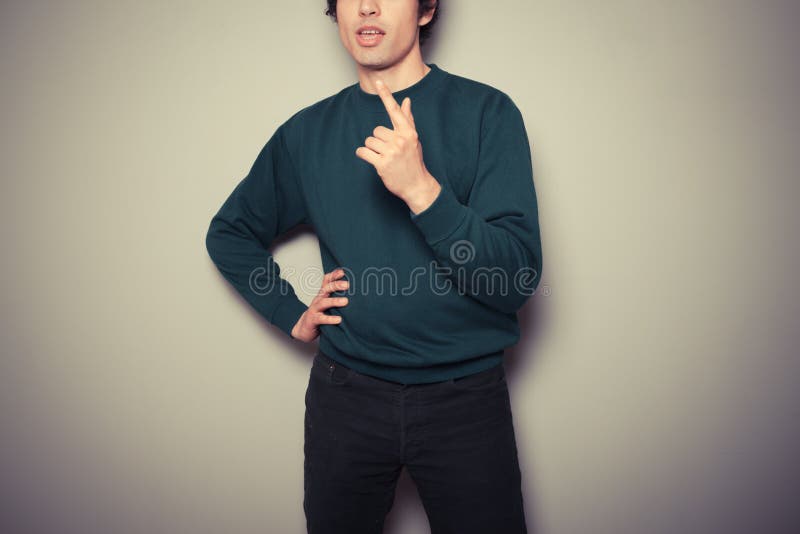 Young Man Thinks he is Cool and is Gesturing with His Hands Stock Photo ...