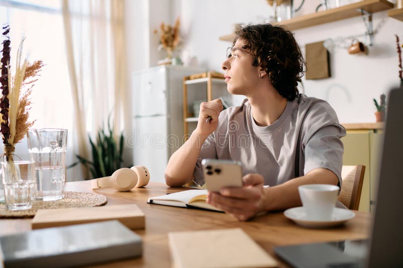 Young Man Thoughtfully Contemplating Work Decisions Stock Image - Image ...