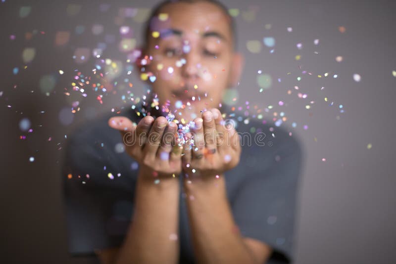 Young Man Throwing Confetti Stock Photo - Image of fiesta, festive ...