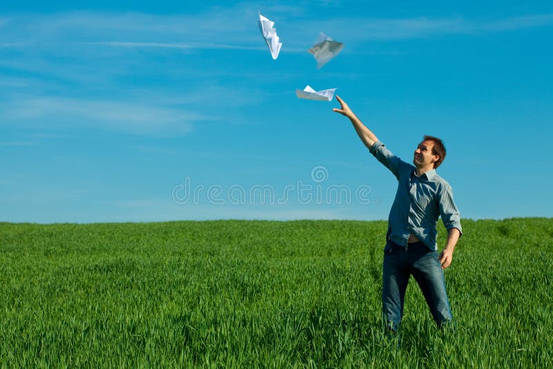 Young man throwing a paper stock image. Image of business - 16737763