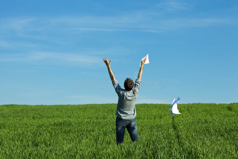 Young man throwing a paper stock photo. Image of motion - 18226914