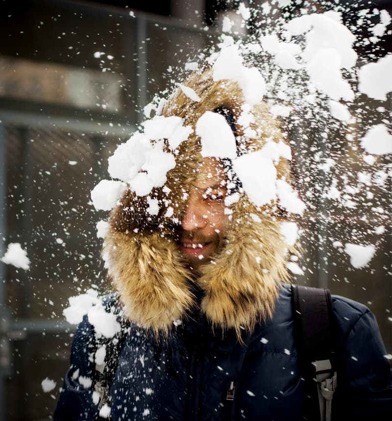 Young man throwing snow stock photo. Image of snow, scarf - 32290766
