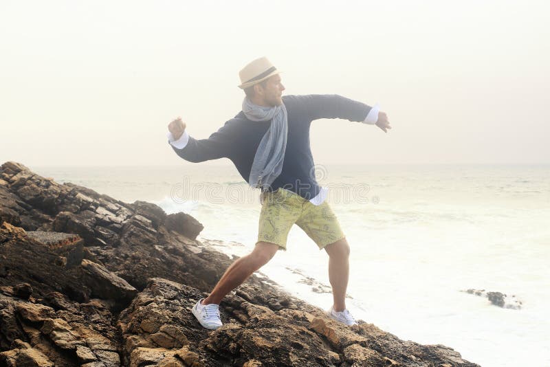 Young man throws stones stock image. Image of happy - 118332205