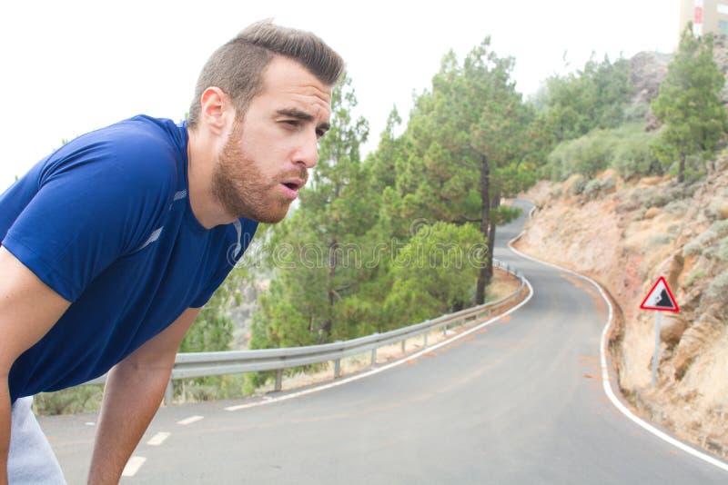 Young Man Tired Exercising on the Road Stock Image - Image of adult ...