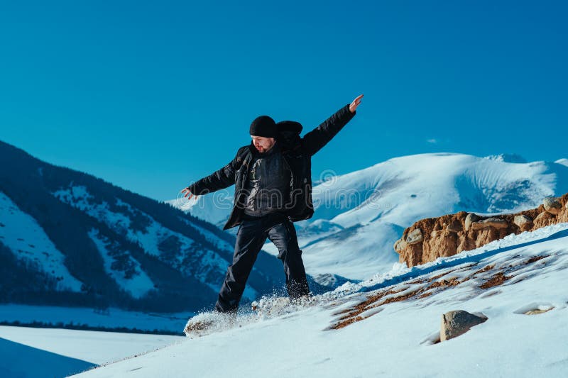 Man Tourist Sliding Down the Side of Mountain Stock Image - Image of ...