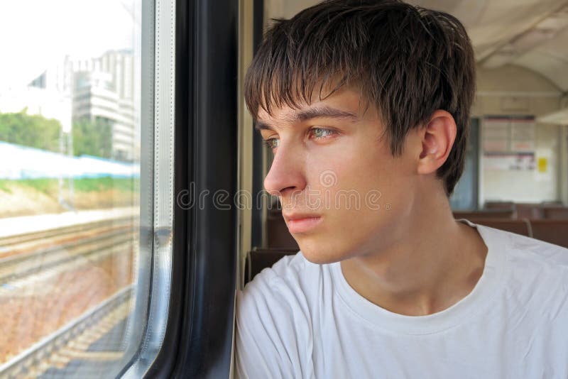 Sad Young Man in the Train stock photo. Image of despondent - 86360374