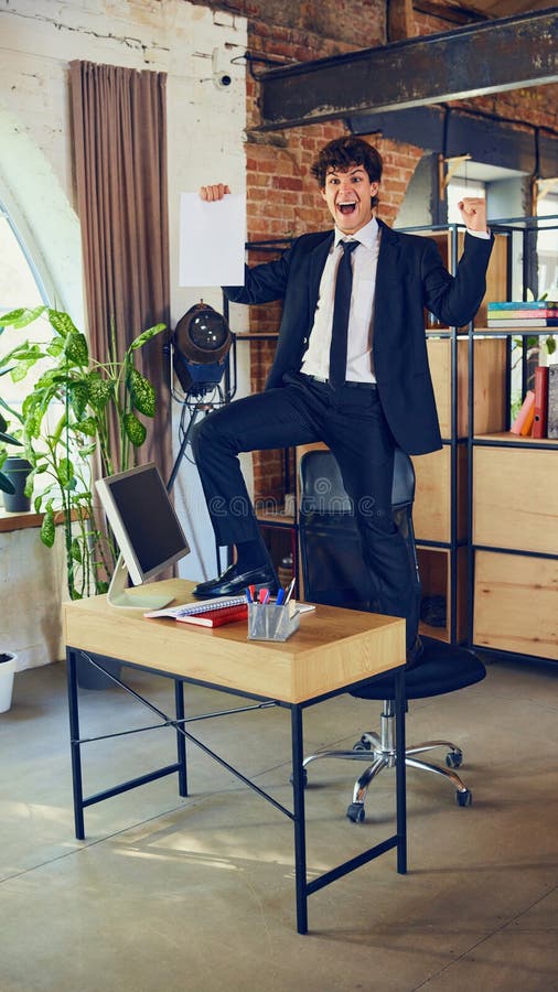 Young Man, Trainee Expressing Happiness and Excitement with Document in ...