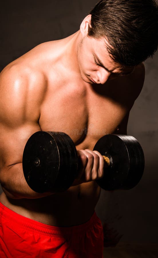 Young Shredded Man in Front of a Wall Stock Image - Image of isolated ...