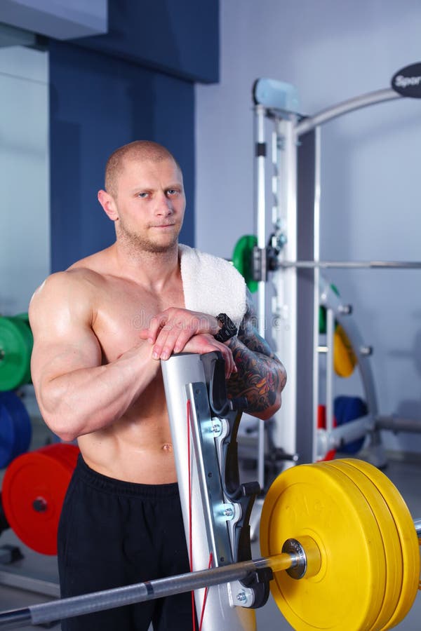 Young Man Training at Gym with Exercises . Young Man Stock Photo ...