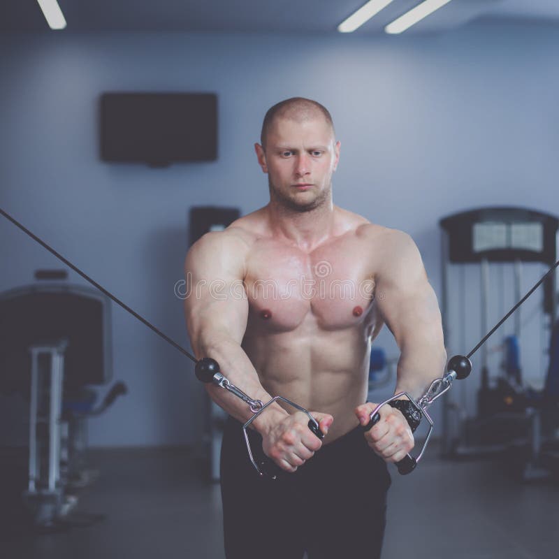 Young Man Training at Gym with Exercises Stock Photo - Image of ...