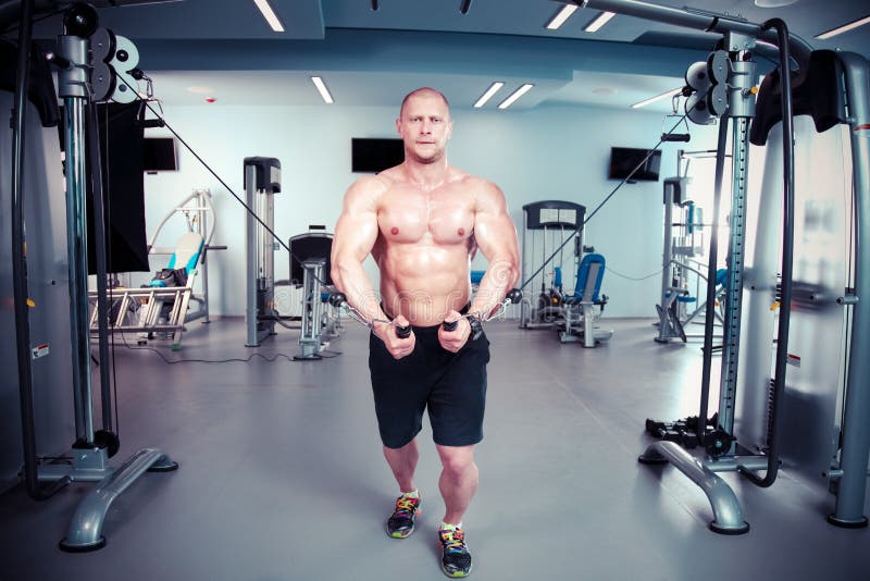 Young Man Training at Gym with Exercises Stock Photo - Image of muscle ...