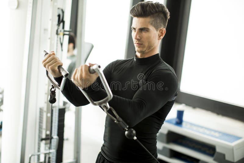 Young Man Training in the Gym Stock Photo - Image of sport, workout ...