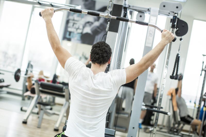 Young Man Training in the Gym Stock Image - Image of muscular ...