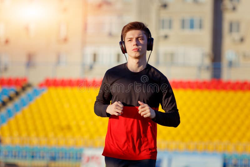 Young Man is Training at a Sports Stadium Stock Image - Image of ...