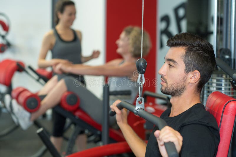 Young Man Training Upper Body Using Barbell Stock Photo - Image of male ...