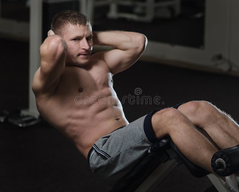 Young Man Trains the Abdominal Muscles of the Abdomen Stock Image ...