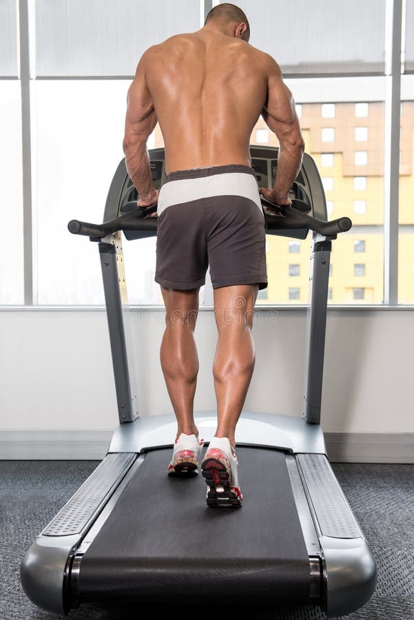 Young Man on Treadmill Back View Stock Photo - Image of fast, legs ...