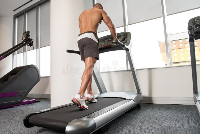 Young Man on Treadmill Back View Stock Photo - Image of determination ...
