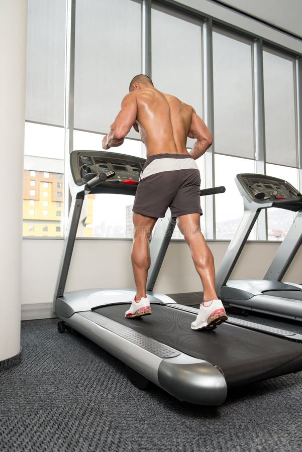 Young Man on Treadmill Back View Stock Image - Image of health ...