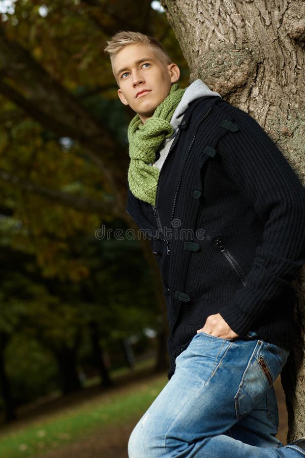 Young Man by Tree in Autumn Park Stock Image - Image of park, leaning ...