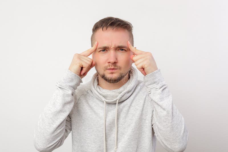 Young Man Tries To Concentrate Hard and To Think Stock Photo - Image of ...