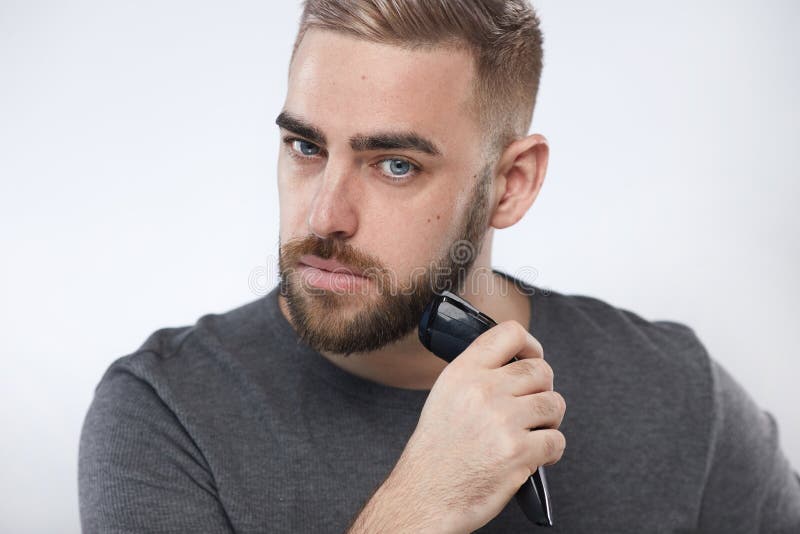 Young Man Trimming Beard stock image. Image of groomer - 167464513