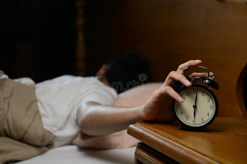 Young Man Turning Off the Alarm Clock Stock Image - Image of alarm ...
