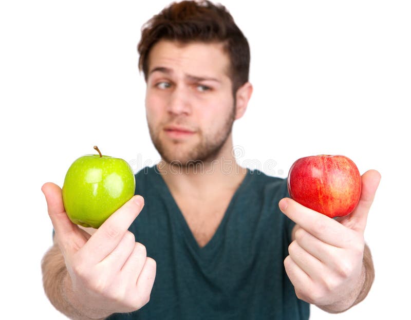 Young man with two apples stock image. Image of confidence - 38564211