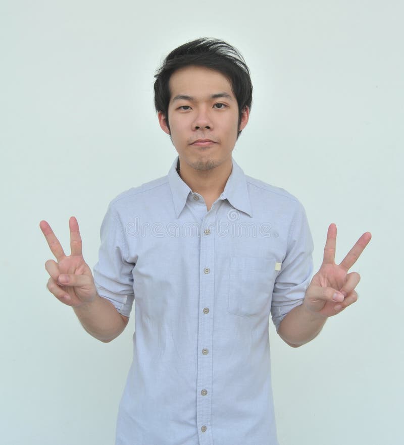 Young man two fingers stock photo. Image of modern, studio - 24096760