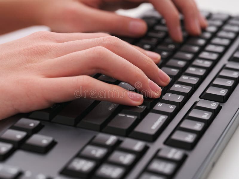 A Young Man Typing on a Black Computer Keyboard Stock Photo - Image of ...