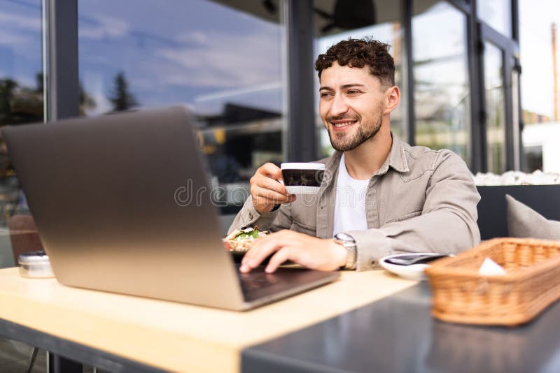 Attractive Happy Young Man Sitting on a Floor in the Living Room ...