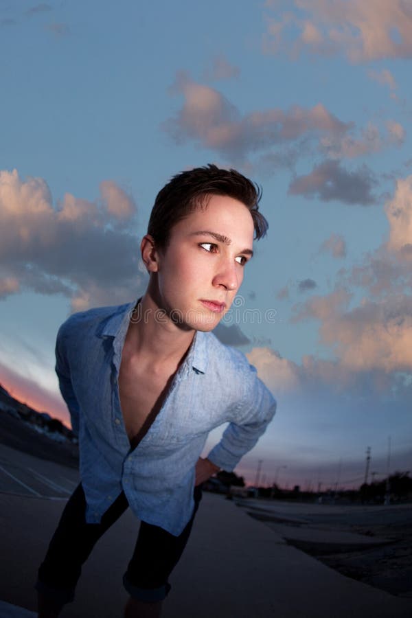 Young Man with Unbuttoned Shirt Stock Photo - Image of serious, dusk ...