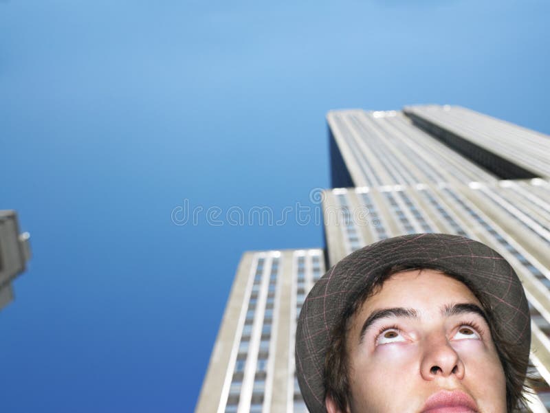 Young Man Under Skyscraper stock photo. Image of clothing - 12580098
