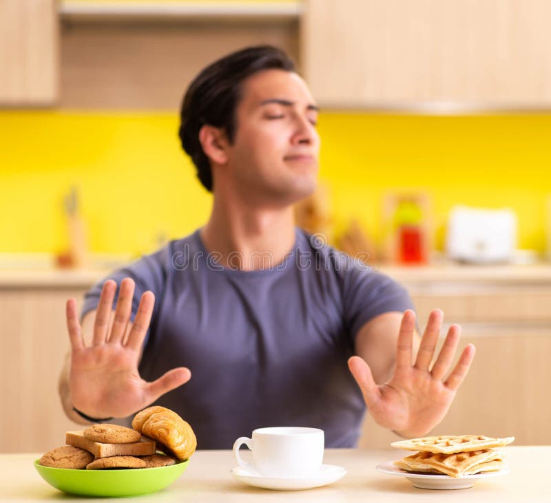 Young Man in Unhealthy Food Concept Stock Image - Image of dinner ...
