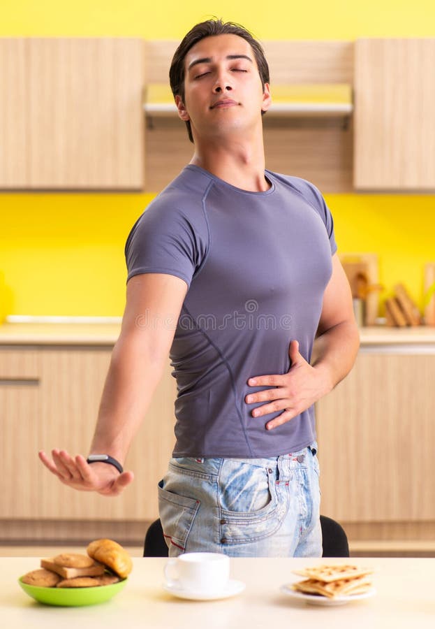 Young Man in Unhealthy Food Concept Stock Photo - Image of bread, diet ...
