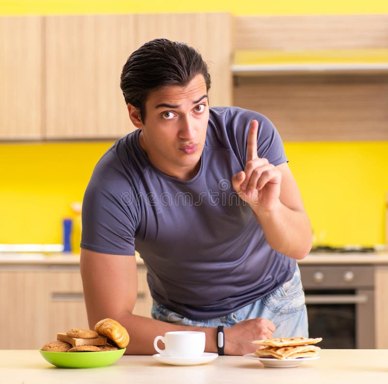 Young Man in Unhealthy Food Concept Stock Photo - Image of dinner ...