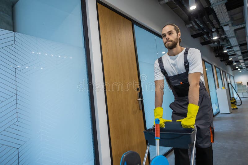Young Man Uniform Walking Office Corridor Pushing Cart Stock Photos ...