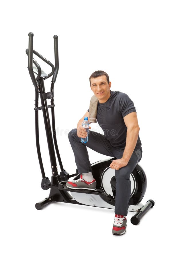 Young Man Uses Elliptical Cross Trainer. Stock Image - Image of plastic ...