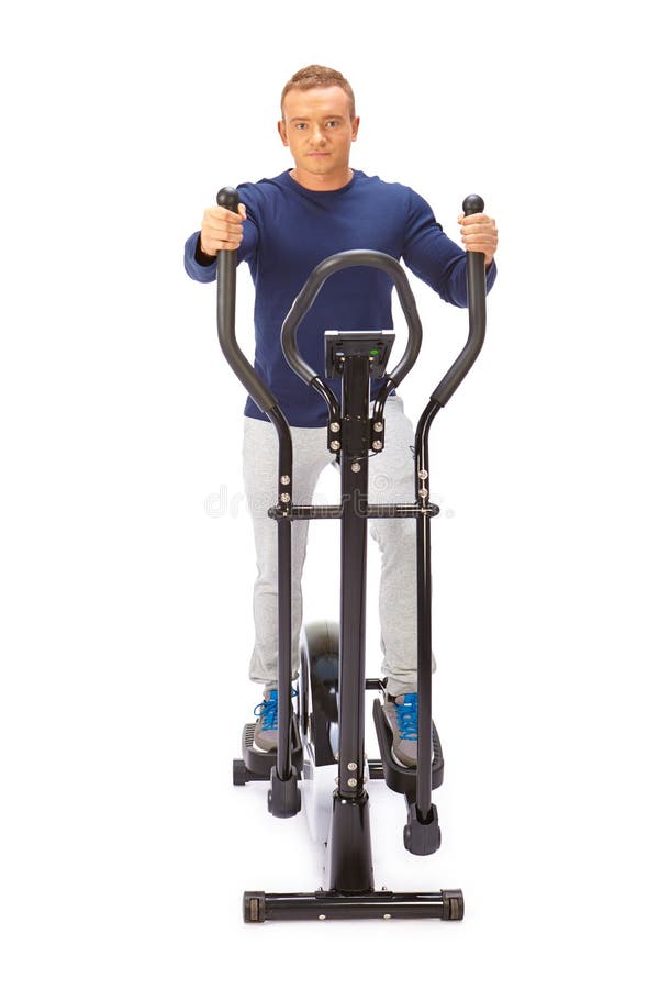 Young Man Uses Elliptical Cross Trainer. Stock Photo - Image of ...