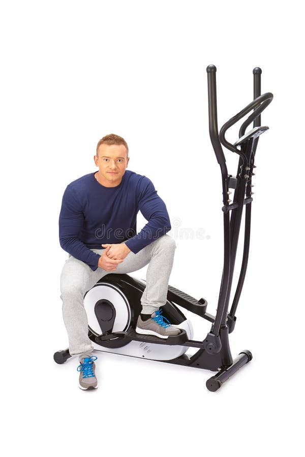Young Man Uses Elliptical Cross Trainer. Stock Image - Image of ...