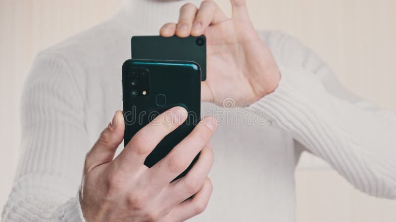 Young Man Uses Smartphone To Scan QR Code on Cold Crypto Wallet for ...