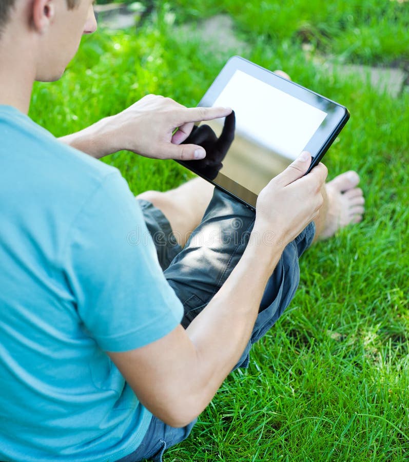 A Young Man Uses Tablet Computer Outdoor Stock Image - Image of hand ...