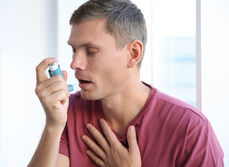 Young Man Using Asthma Inhaler Stock Photo - Image of drug, inhalation ...