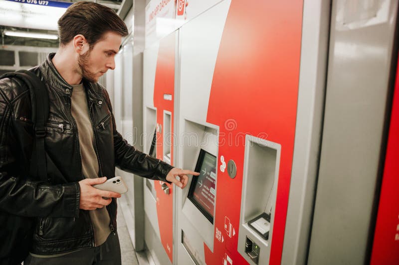 Young Man Using Atm Bank Machine while Standing in Subway Stock Image ...